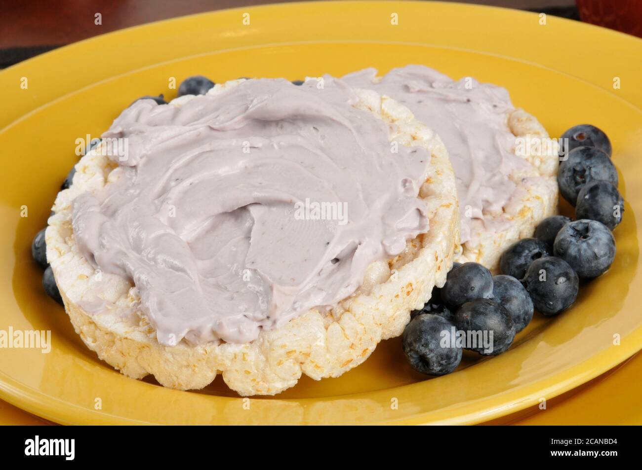 Blueberry cream cheese on rice cakes with fresh blueberries Stock Photo ...