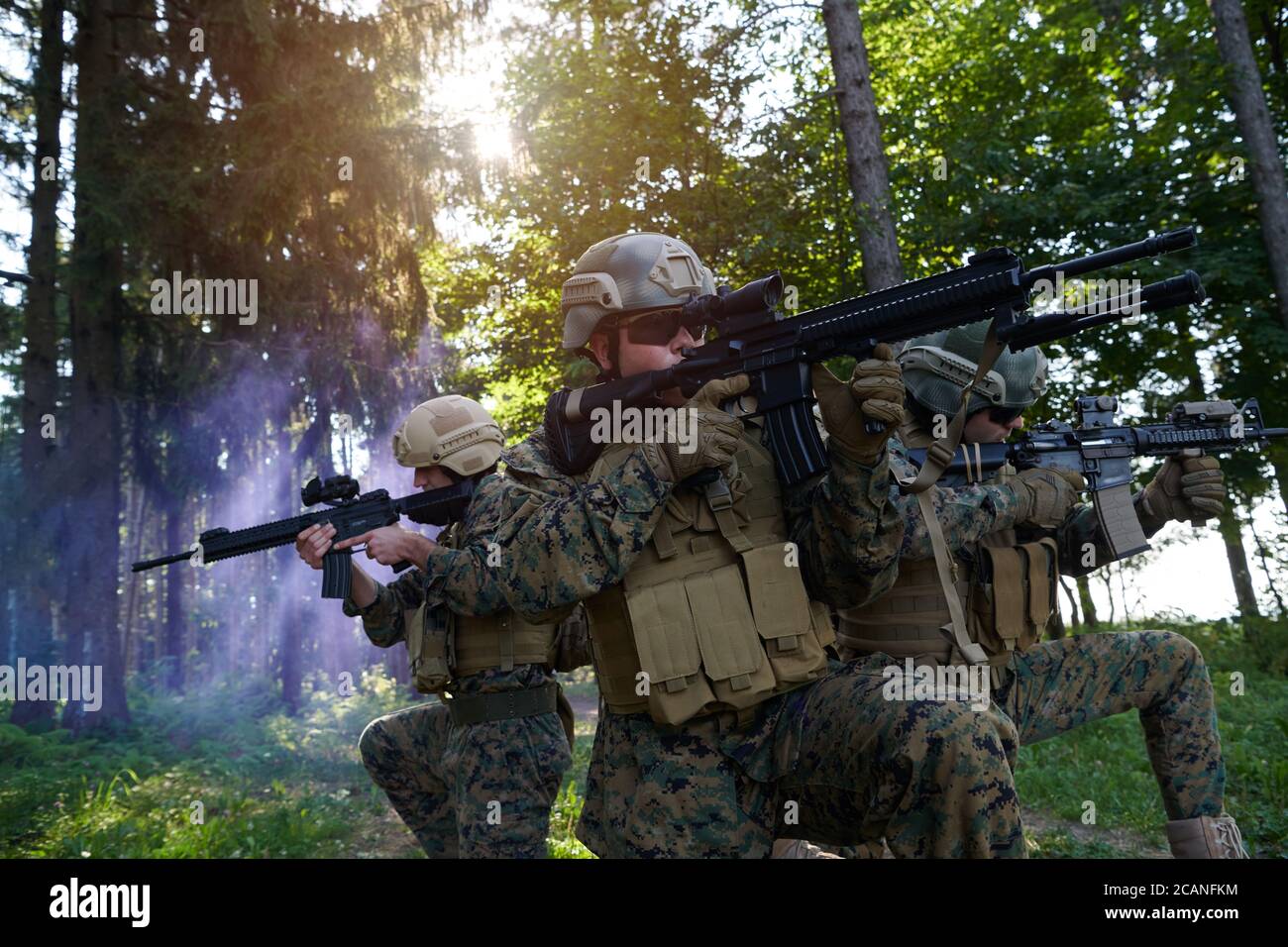 Soldier fighters standing together with guns. Group portrait of US army ...