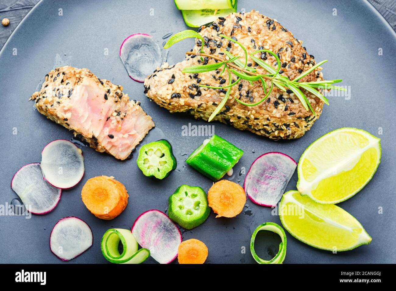 Baked tuna with vegetable garnish.Fish cooked with vegetables.Fried ...