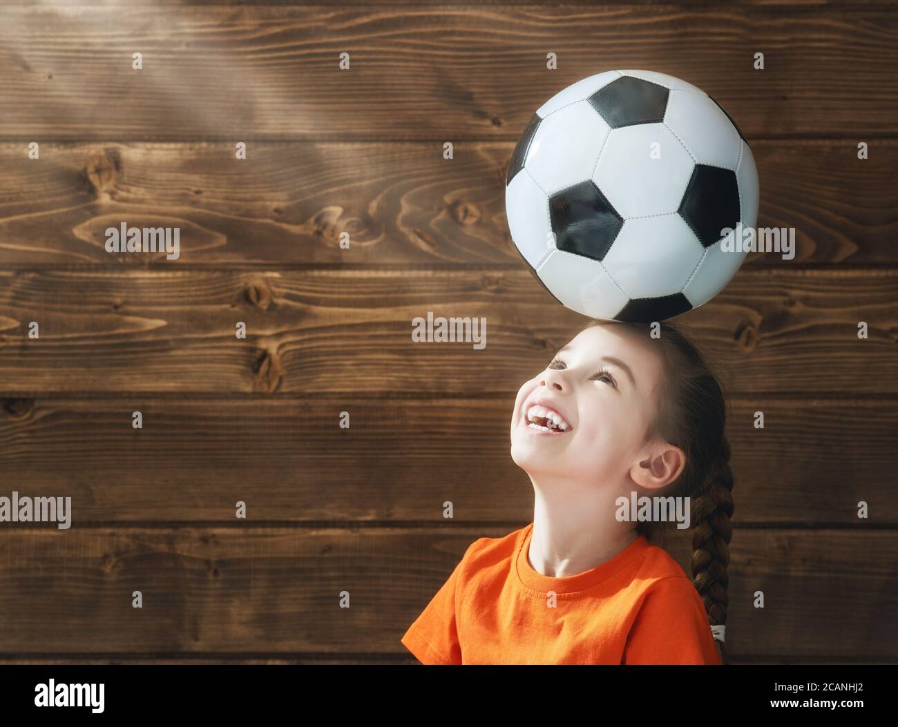 Cute little child dreams of becoming a soccer player. Child plays ...