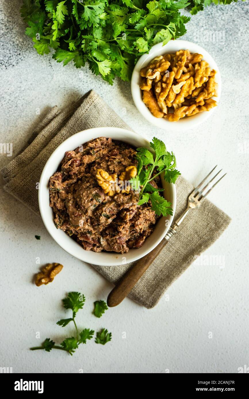 Traditional georgian bean dish - lobio with walnut, served in modern ...