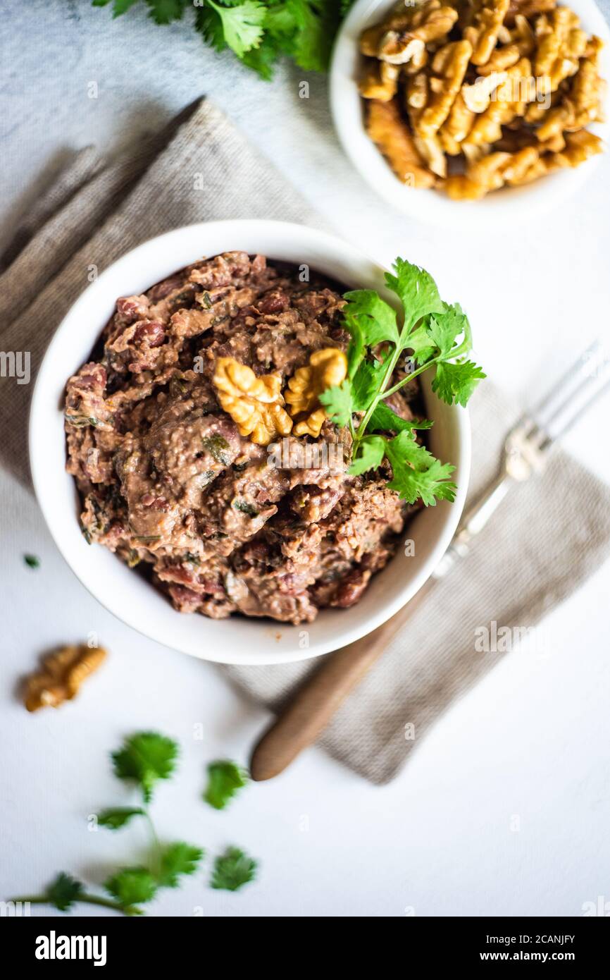 Traditional georgian bean dish - lobio with walnut, served in modern ...