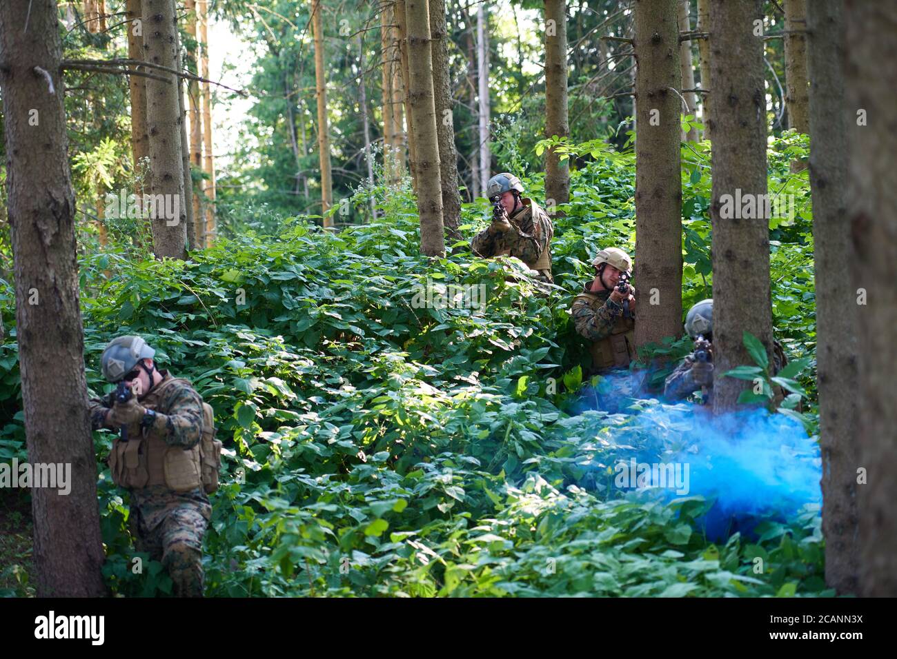 Modern warfare Soldiers Squad Running as Team in Battle Formation Stock ...