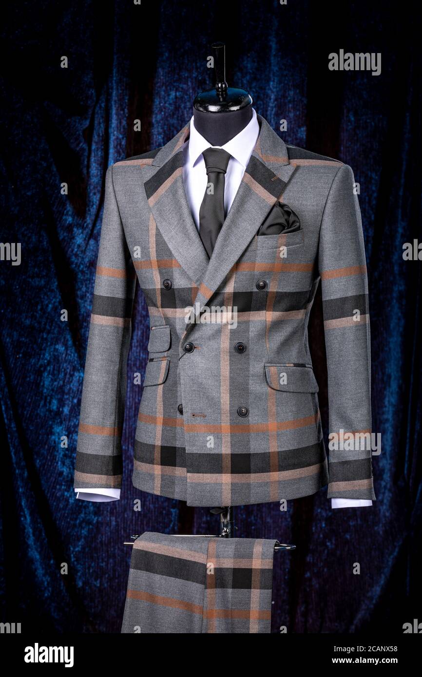 Stylish men's gray check suit on a mannequin or dummy. Men's Clothing ...