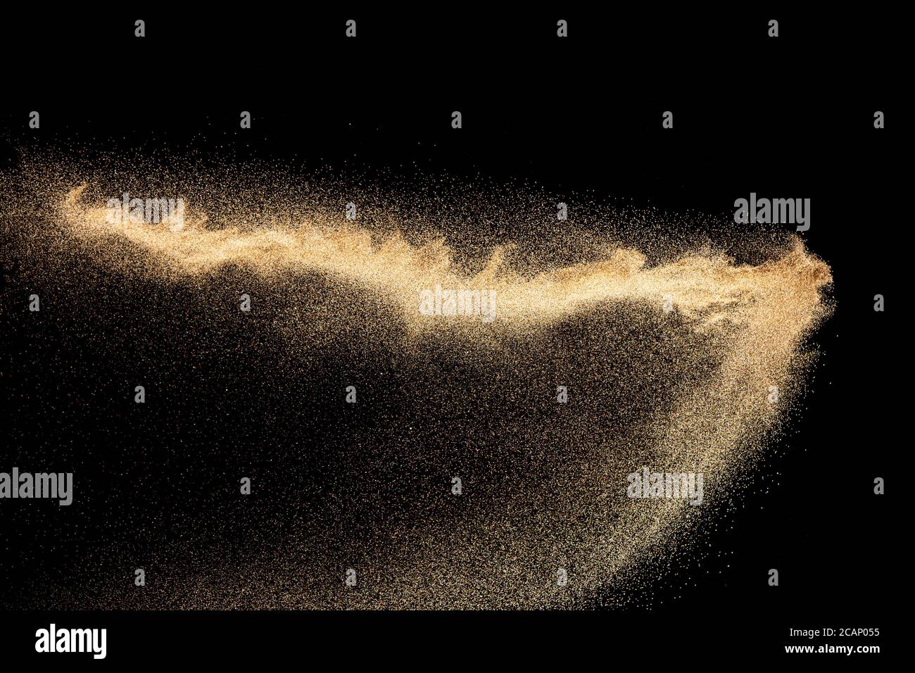 Brown colored sand splash.Dry river sand explosion isolated on black ...