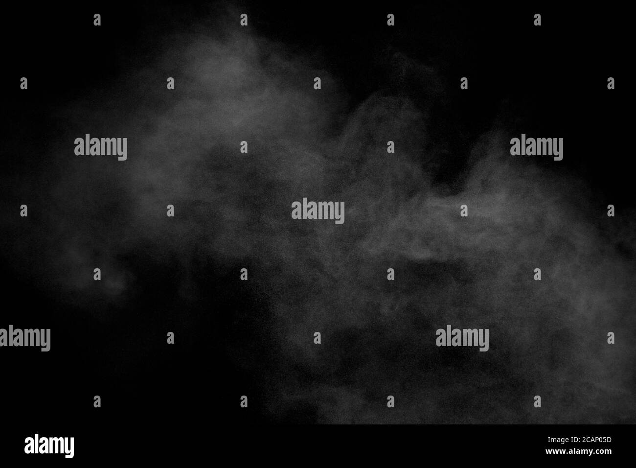 White powder explosion clouds.Freeze motion of white dust particles ...