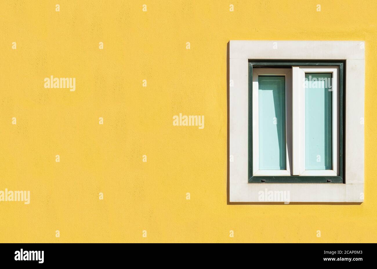 Window On Yellow Wall Stock Photo - Alamy