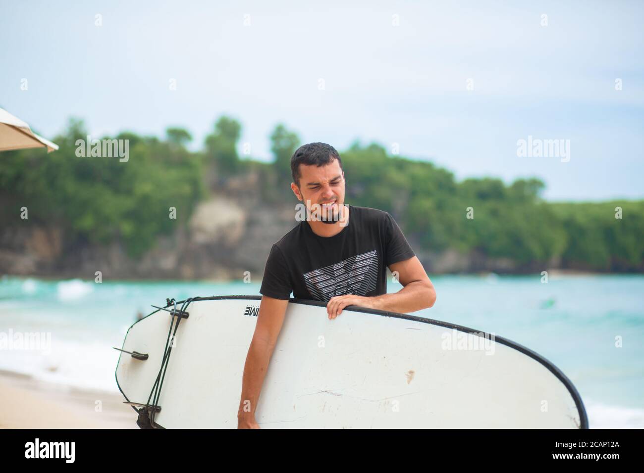 Surfer. Surfing Man With Surfboard Walking On Sandy tropical Beach ...