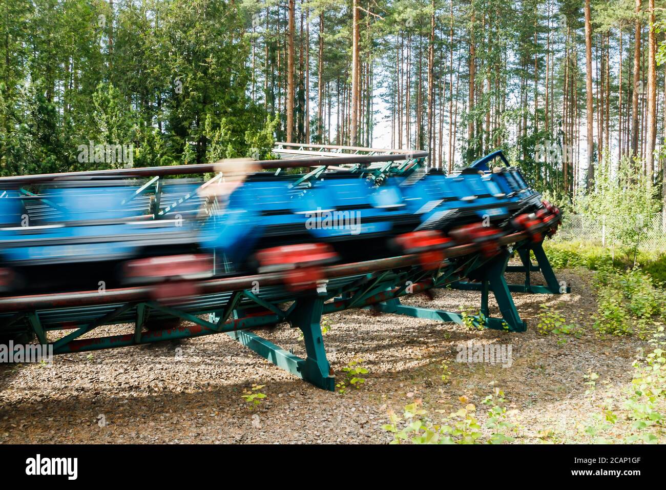 Ride Roller coaster in motion in amusement park at summer day Stock ...