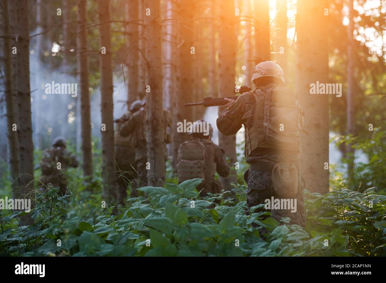Modern warfare Soldiers Squad Running as Team in Battle Formation Stock ...