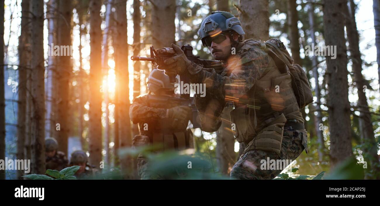 Modern warfare Soldiers Squad Running as Team in Battle Formation Stock ...