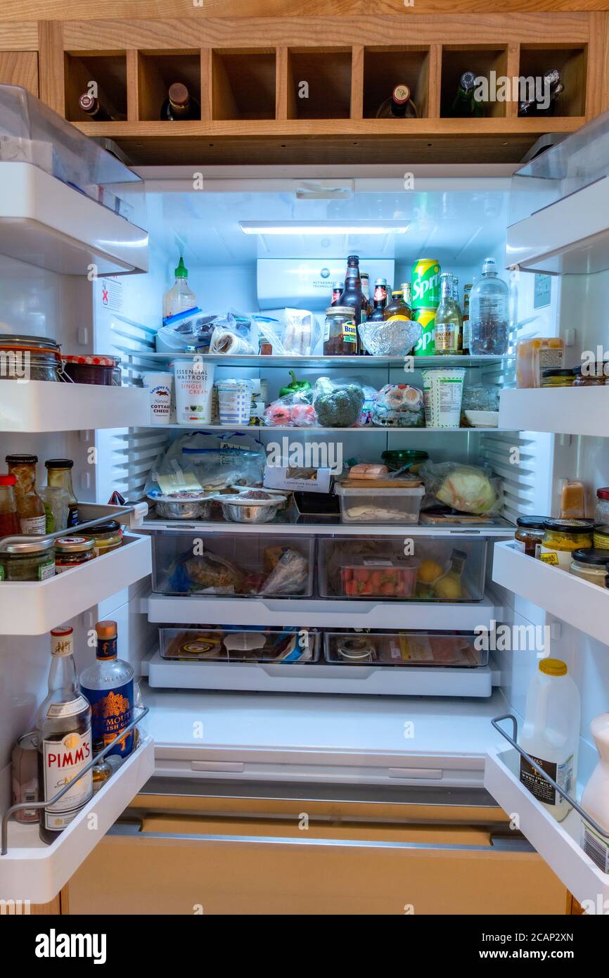 looking inside a large double fridge freezer Stock Photo - Alamy