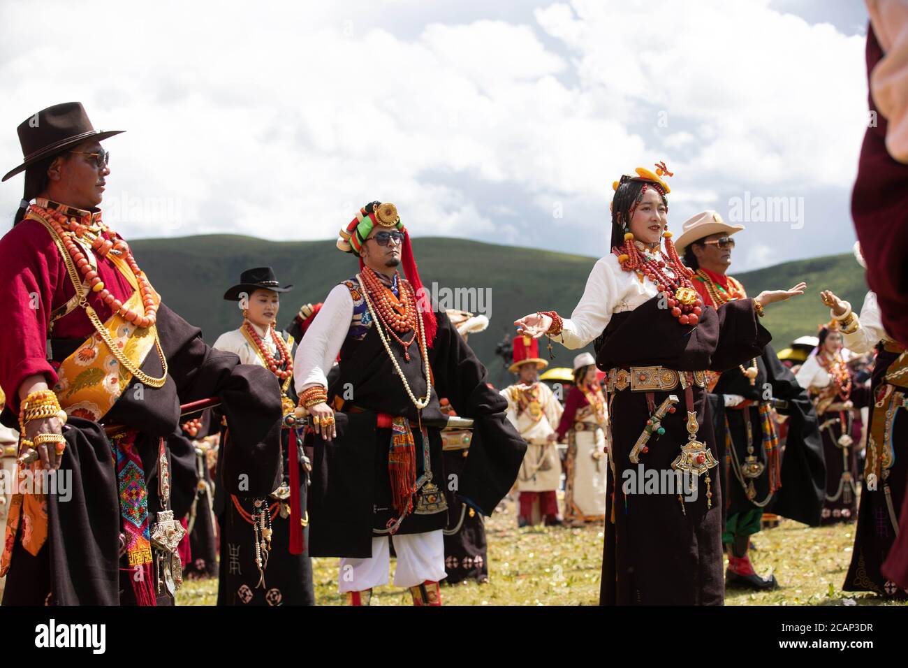 Sertar, China's Sichuan Province. 7th Aug, 2020. Locals take part in a ...