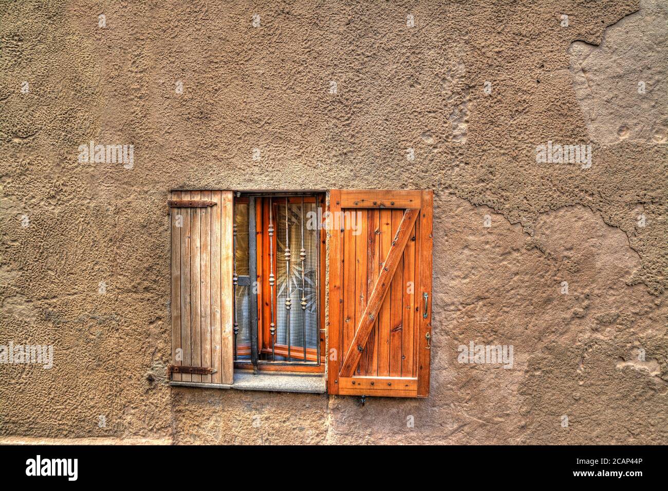wooden window in a rustic wall. Processed for hdr tone mapping effect ...