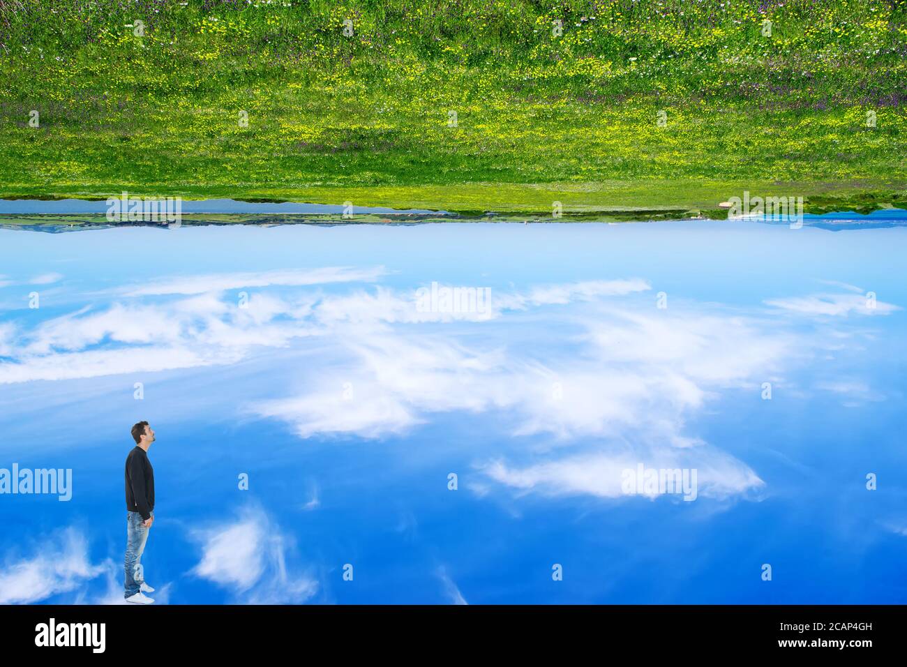 man looking at a upside down world Stock Photo - Alamy