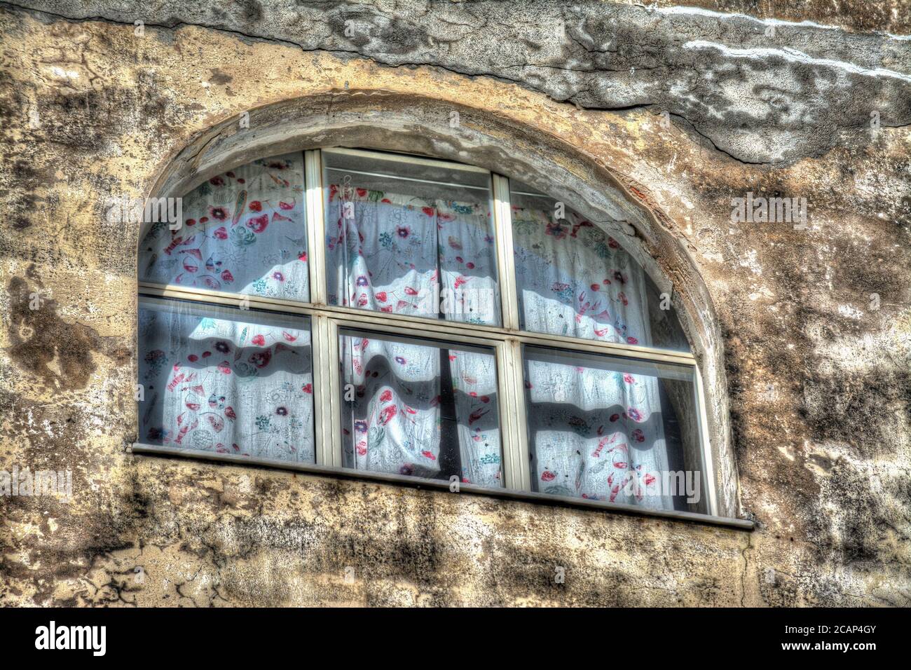 old window with curtain in a rustic wall. Processed for hdr tone ...