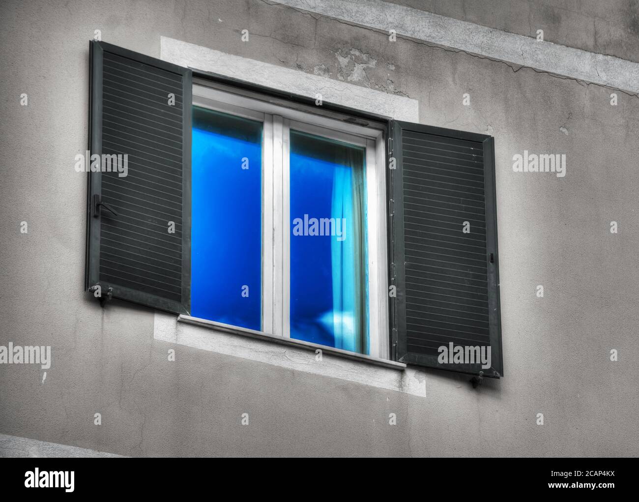 blue sky reflected in a window. Processed for selective desaturation ...