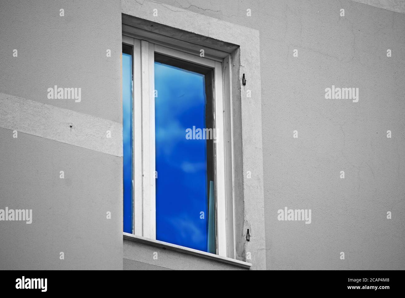 blue sky reflected in a window. Processed for selective desaturation ...