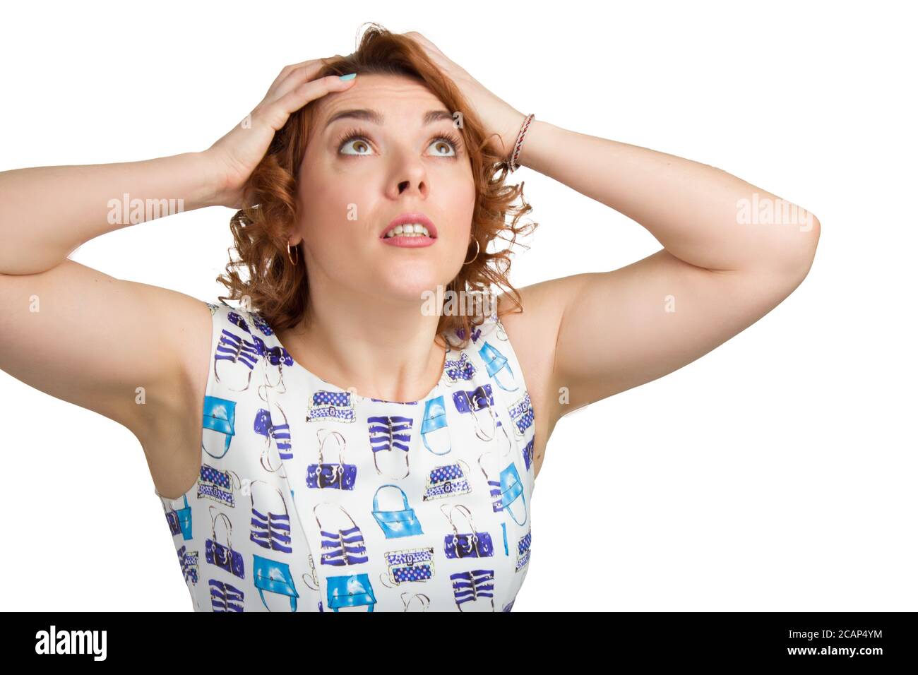 Portrait of a young redheaded overweight woman on a white background ...