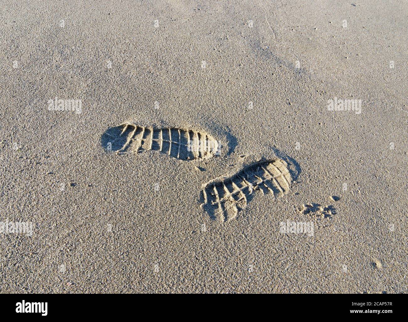 close up of two footprints in the sand Stock Photo - Alamy