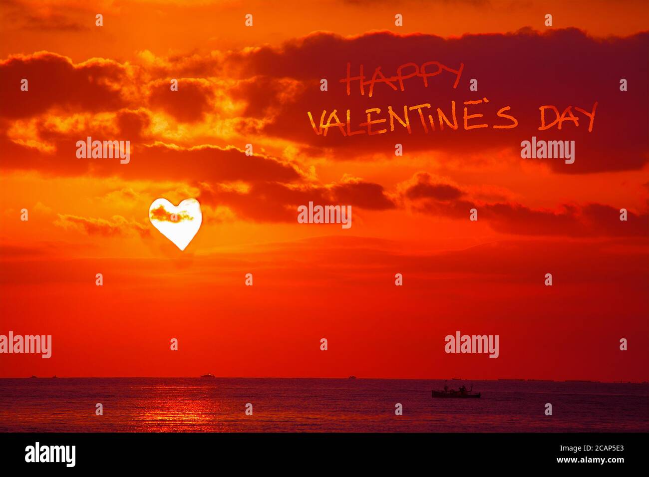 happy valentine's day written in the sky with heart shaped sun at ...
