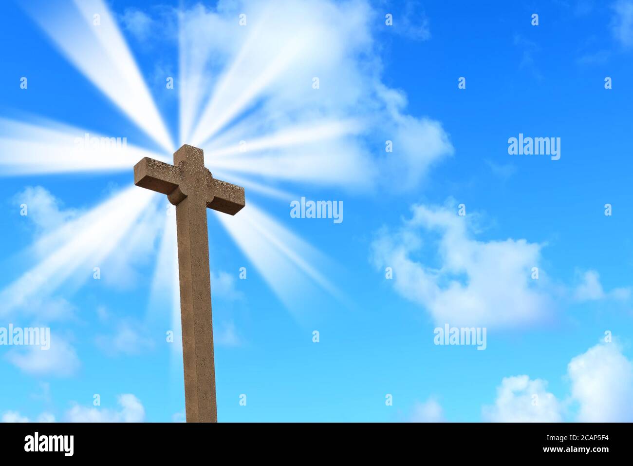 holy cross under a colorful sky with sunrays Stock Photo - Alamy
