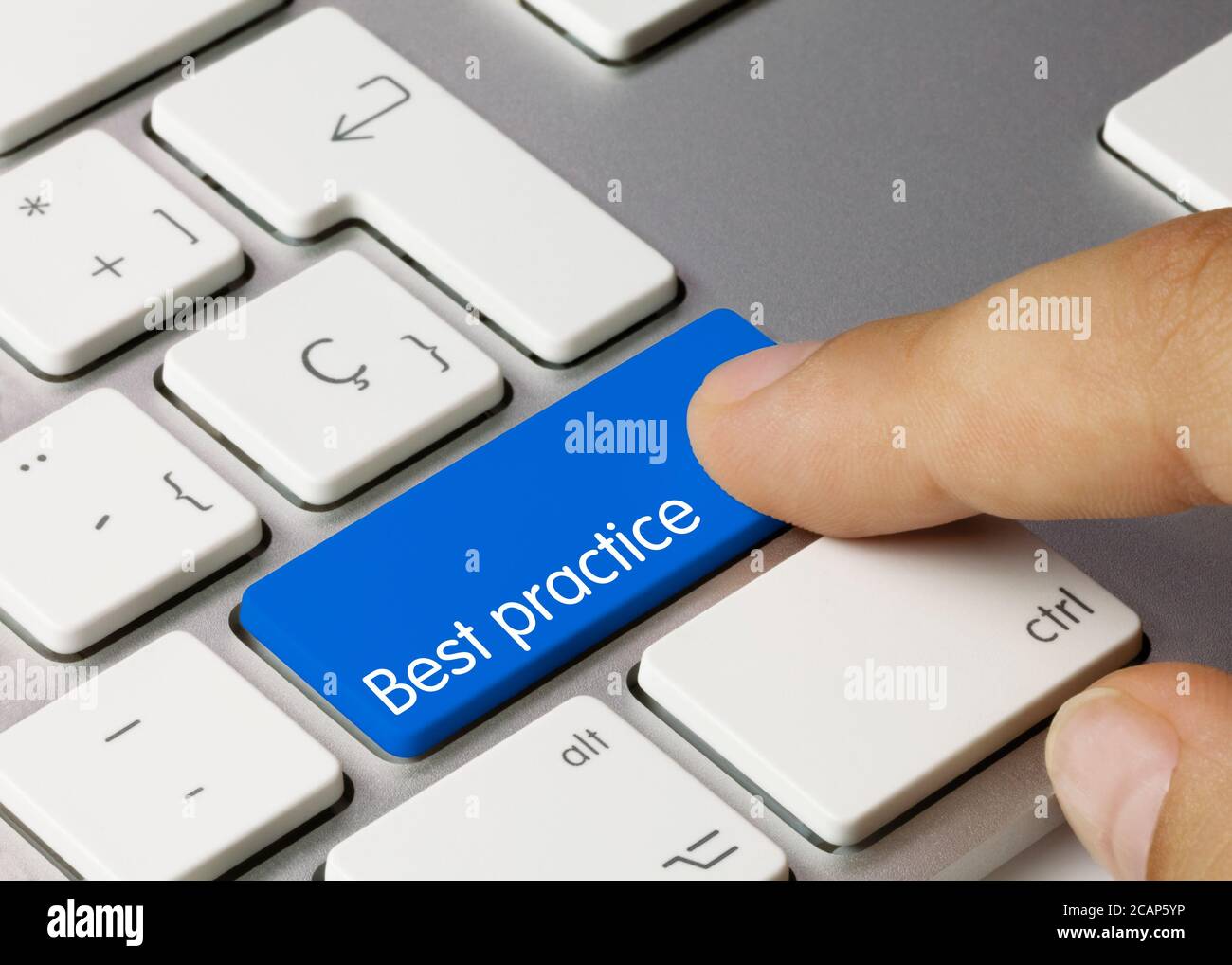 Best practice Written on Blue Key of Metallic Keyboard. Finger pressing ...
