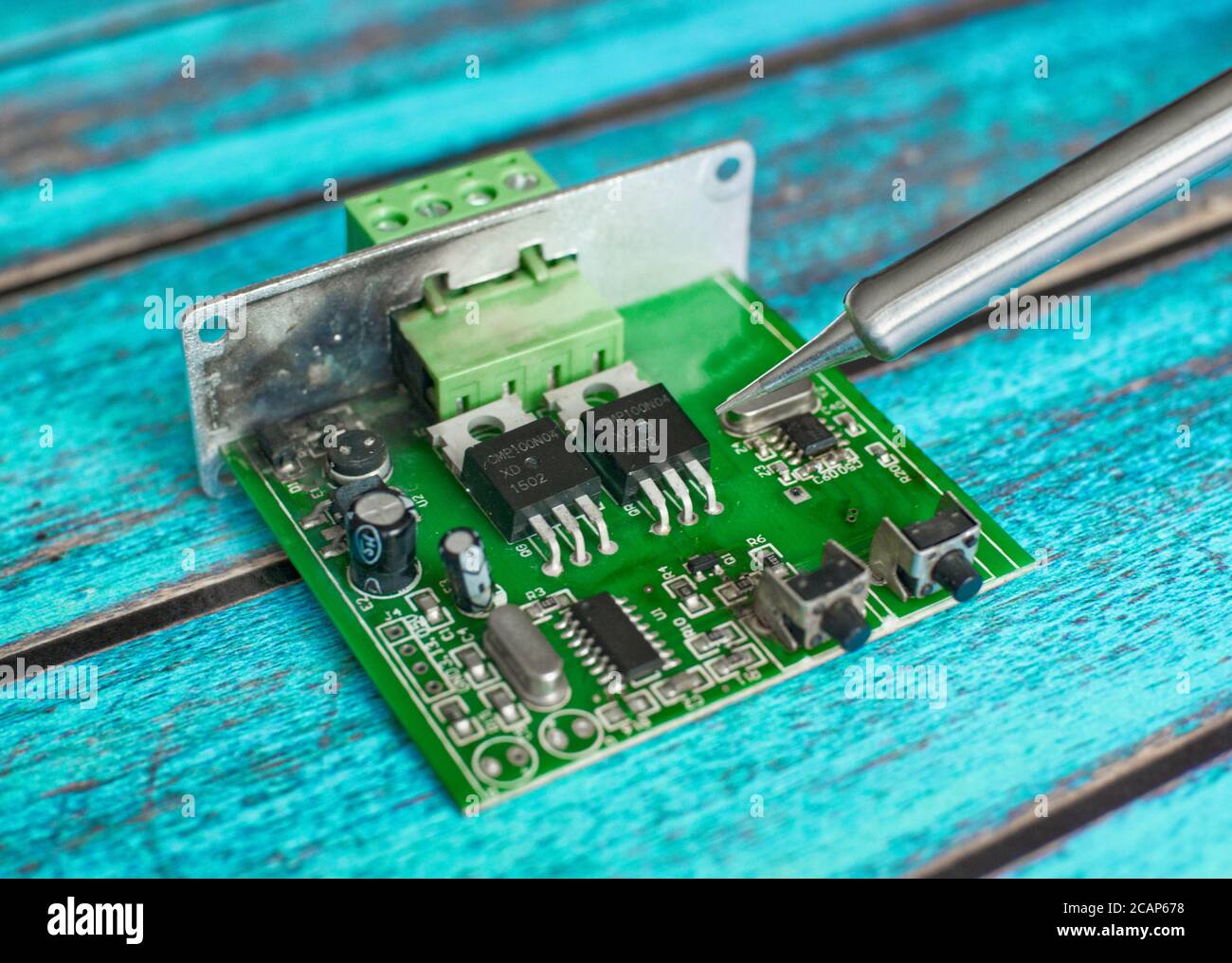 Damaged electronic board during repair with a soldering iron Stock ...