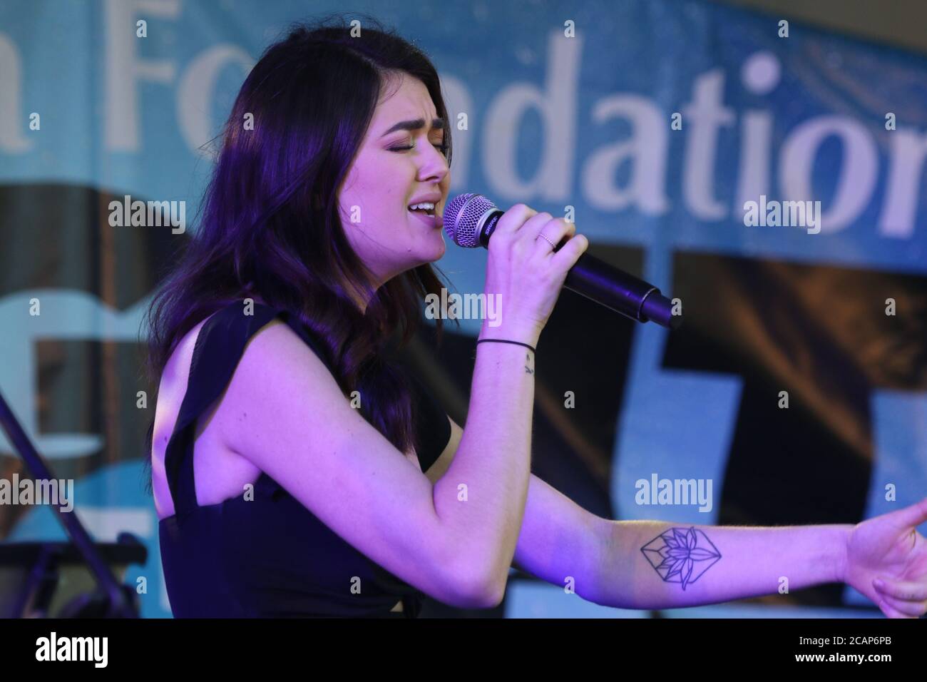 Singer Claire Howell, who appeared on The Voice performs at Light the ...
