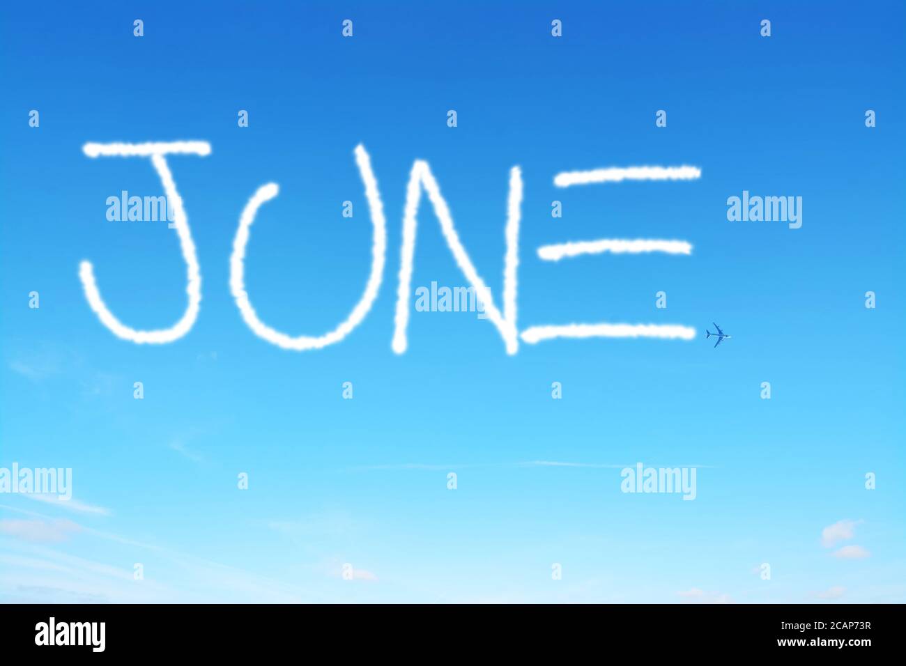june written in the sky with contrails Stock Photo - Alamy