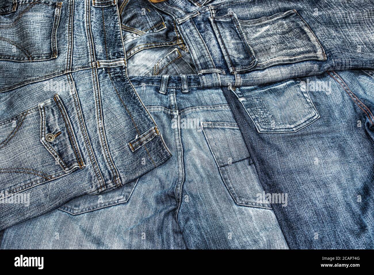 different pairs of jeans seen from behind Stock Photo - Alamy