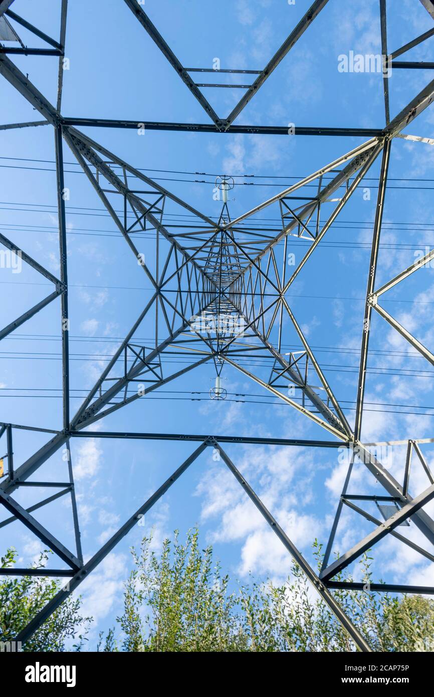 Eleccticity pylons in natural environment Stock Photo - Alamy