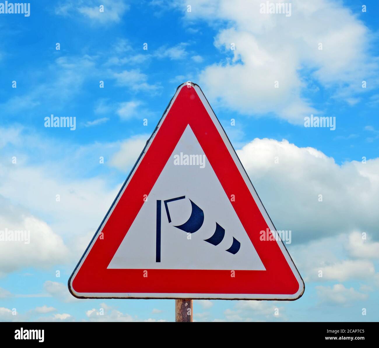wind sock sign under a blue sky with clouds Stock Photo - Alamy