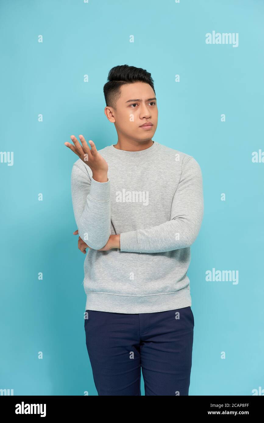 Disturbed confused shocked guy questioning raising hand isolated on ...