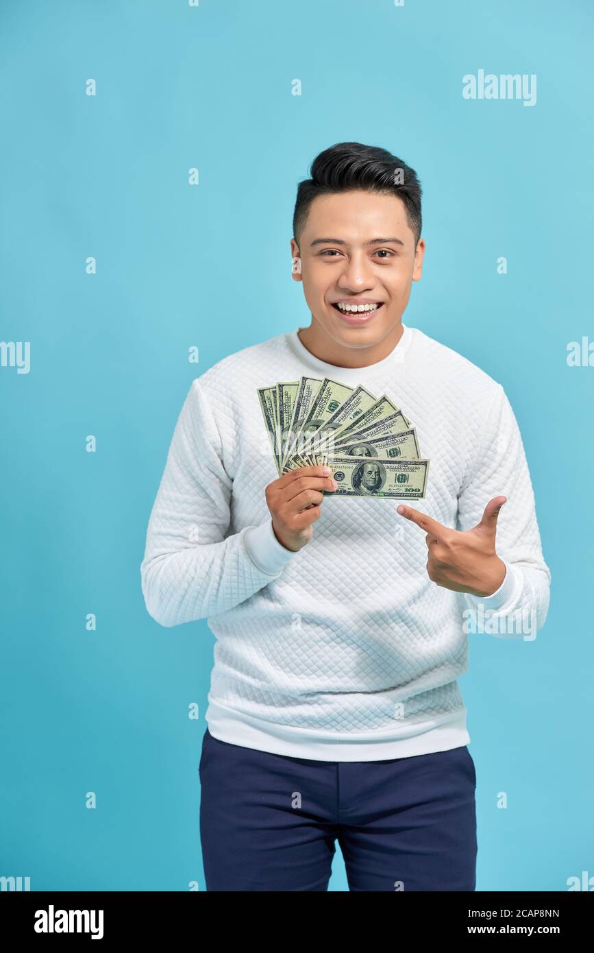 Man holding money hi-res stock photography and images - Alamy