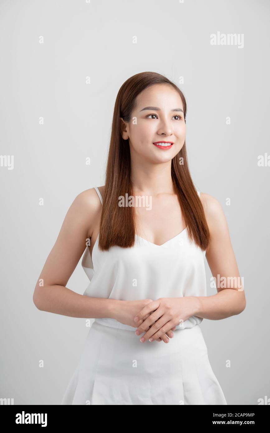 Attractive Asian woman thinking isolated on white background Stock ...