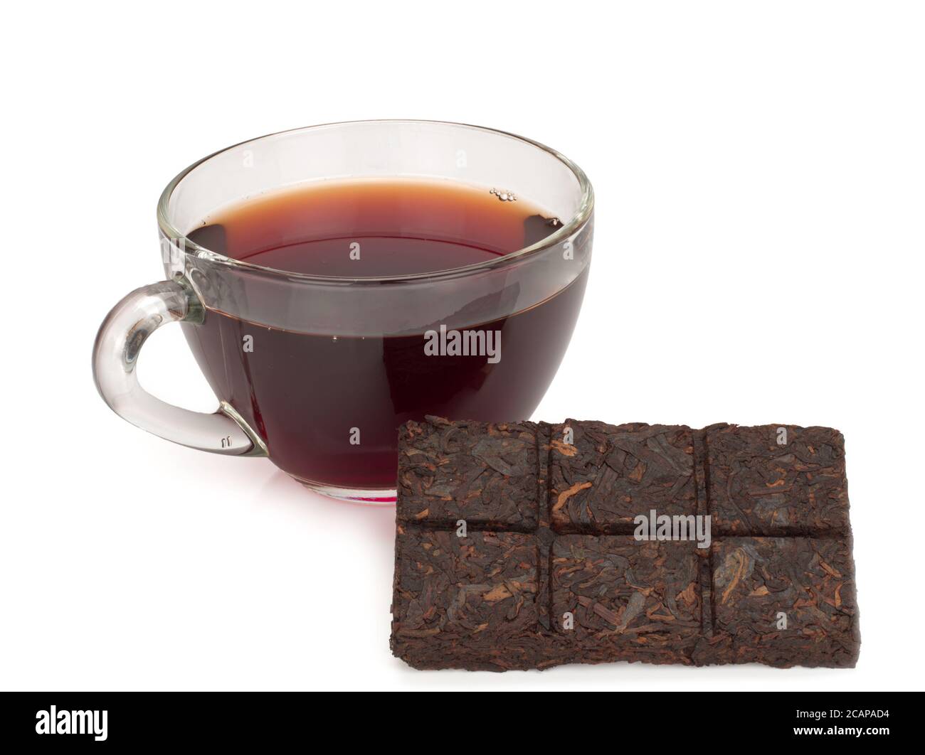 Aromatic black pu-erh tea from China on white background. 5 years old ...