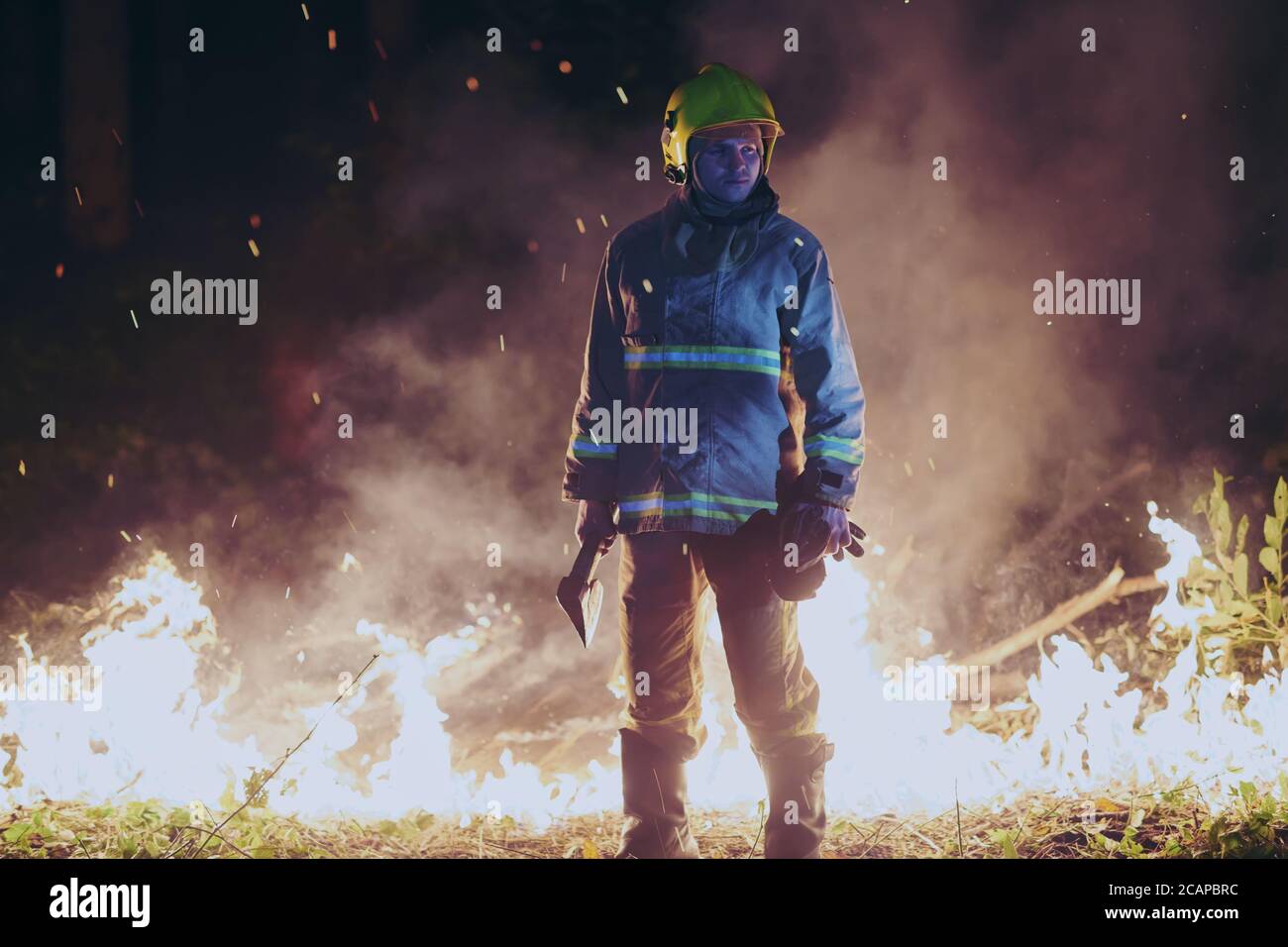 firefighter portrait on authentic fire location in forest Stock Photo ...