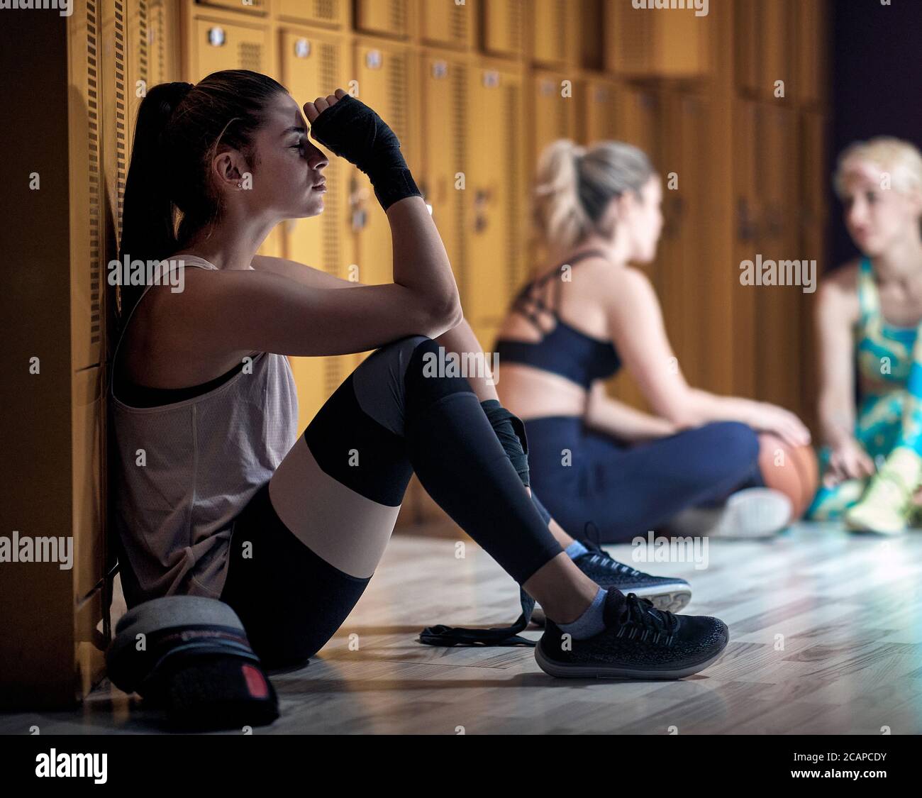 Young girl in a locker room focusing on a boxing training Stock Photo ...