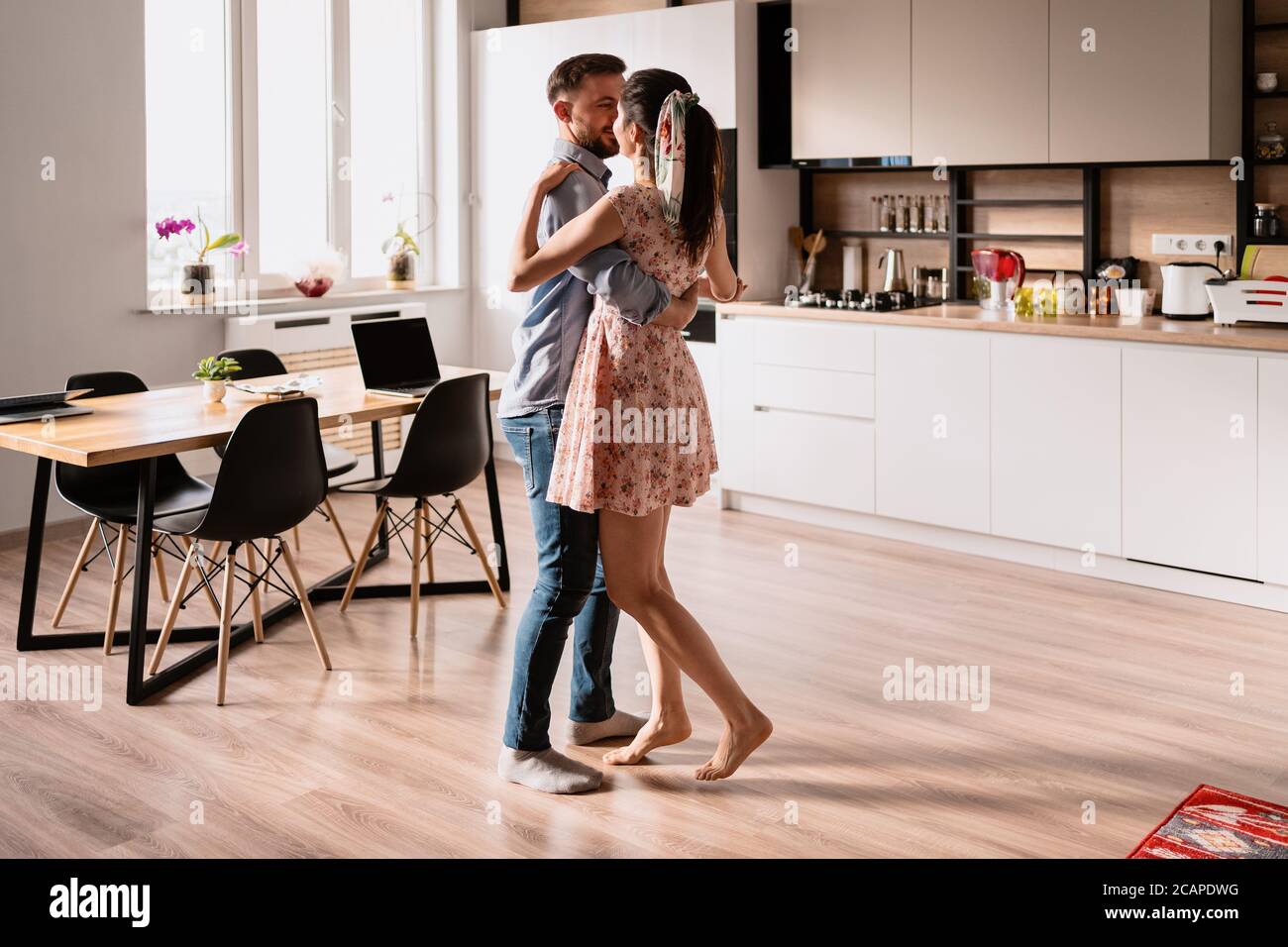Happy young couple dancing at home in the modern living, Best weekend ...