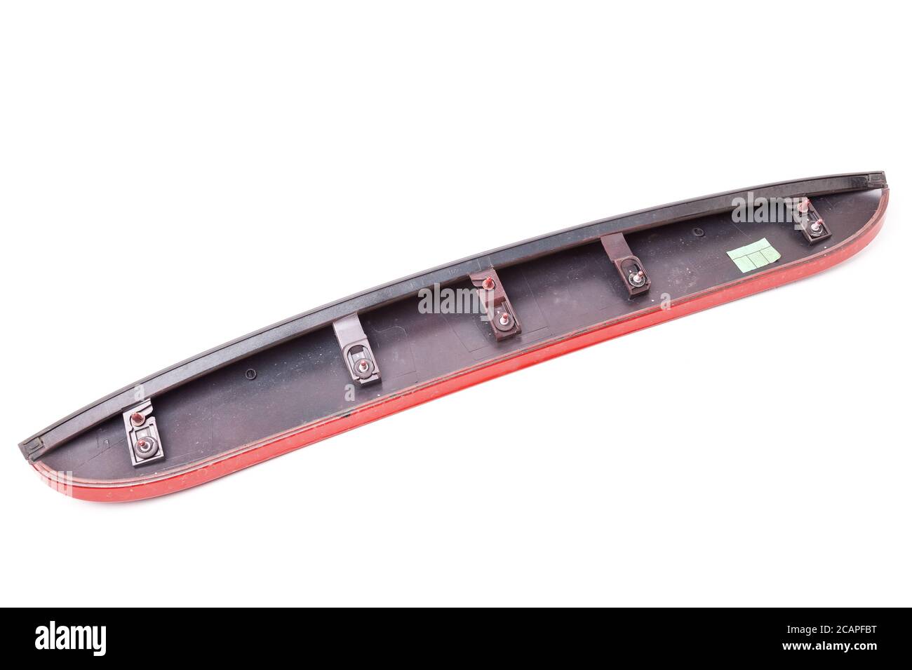 Red sports style spoiler for installation on the trunk lid on a white ...