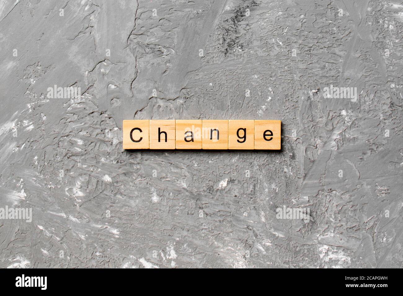 CHANGE word written on wood block. CHANGE text on cement table for your ...