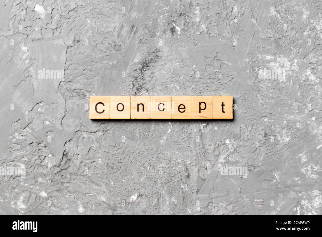 Concept word written on wood block. Concept text on table, concept ...
