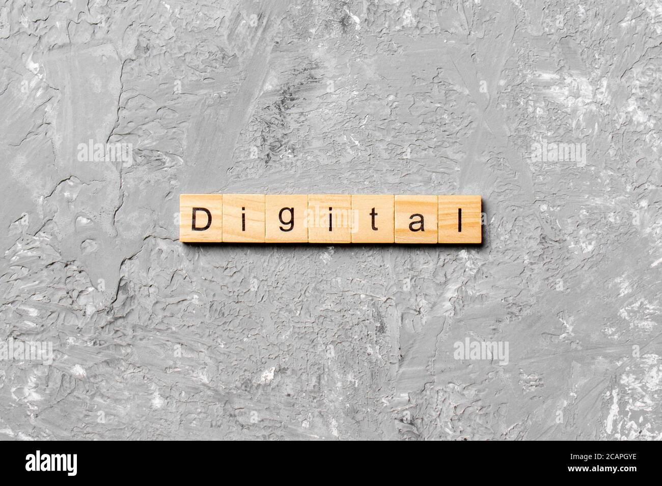 DIGITAL word written on wood block. DIGITAL text on cement table for ...