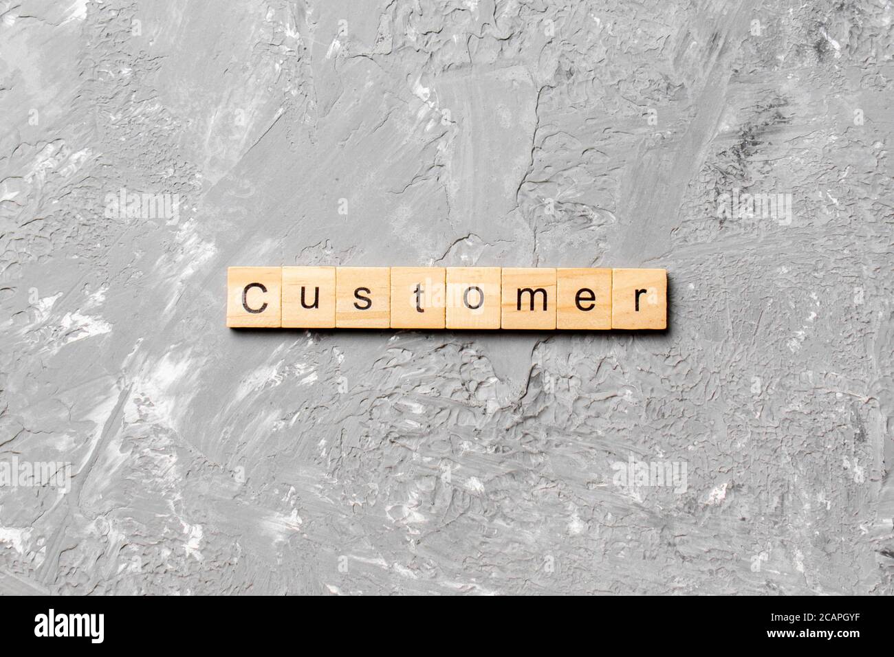customer word written on wood block. customer text on table, concept ...