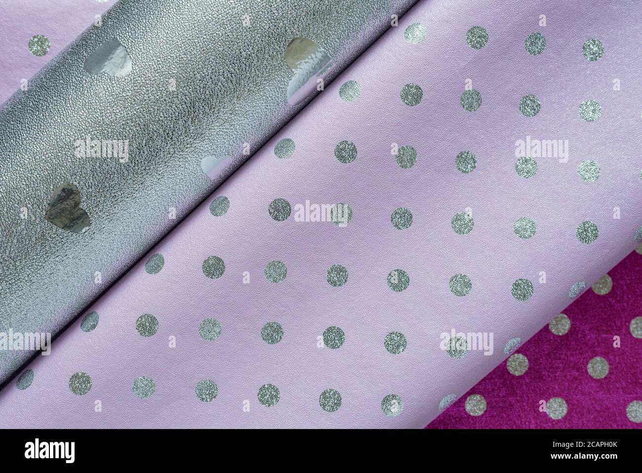 Several types of wrapping paper. Lilac polka dot silver Stock Photo - Alamy