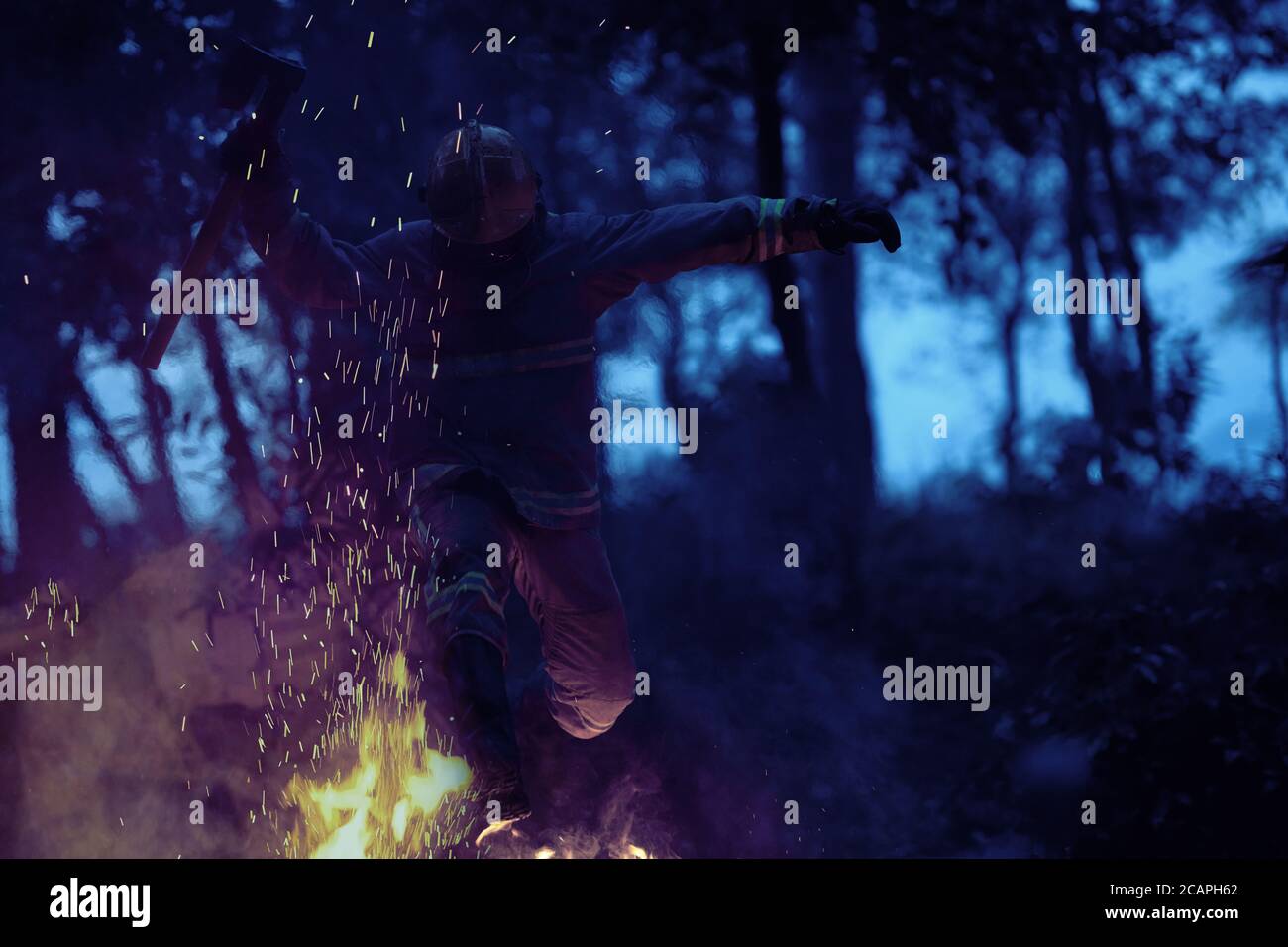 firefighter hero in action danger jumping over fire flame to rescue and ...