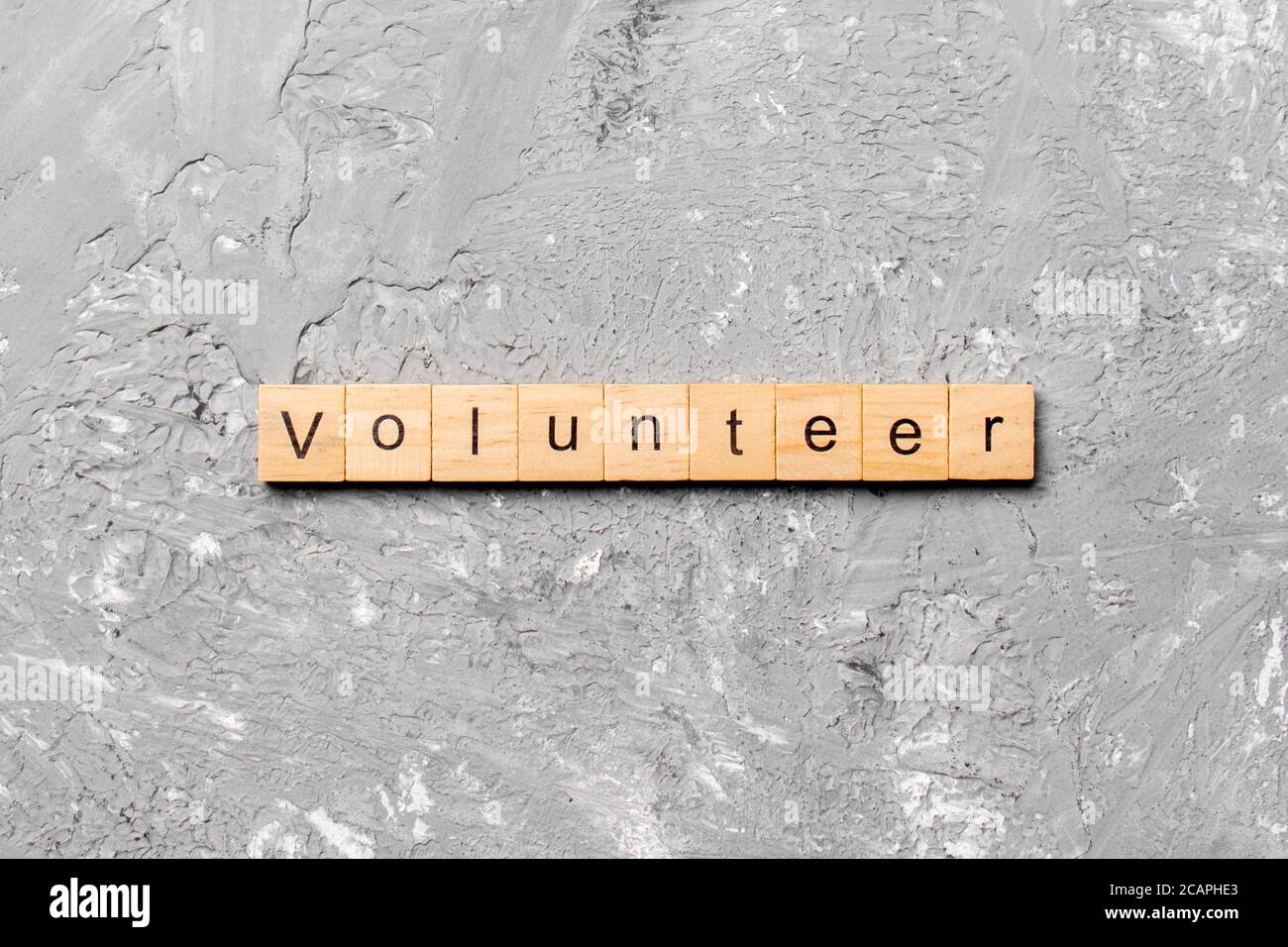volunteer word written on wood block. volunteer text on table, concept ...