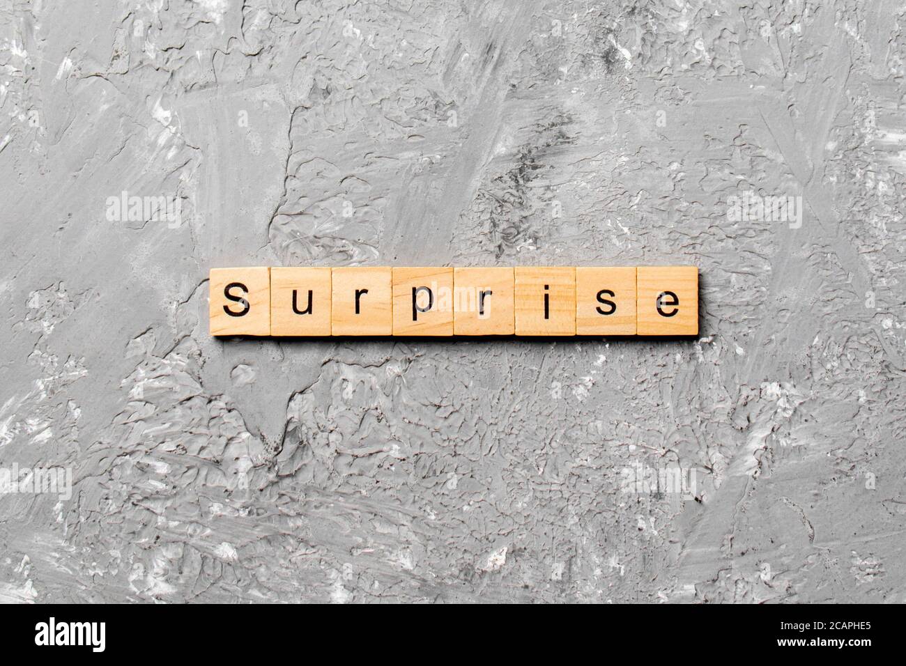 surprise word written on wood block. surprise text on table, concept ...