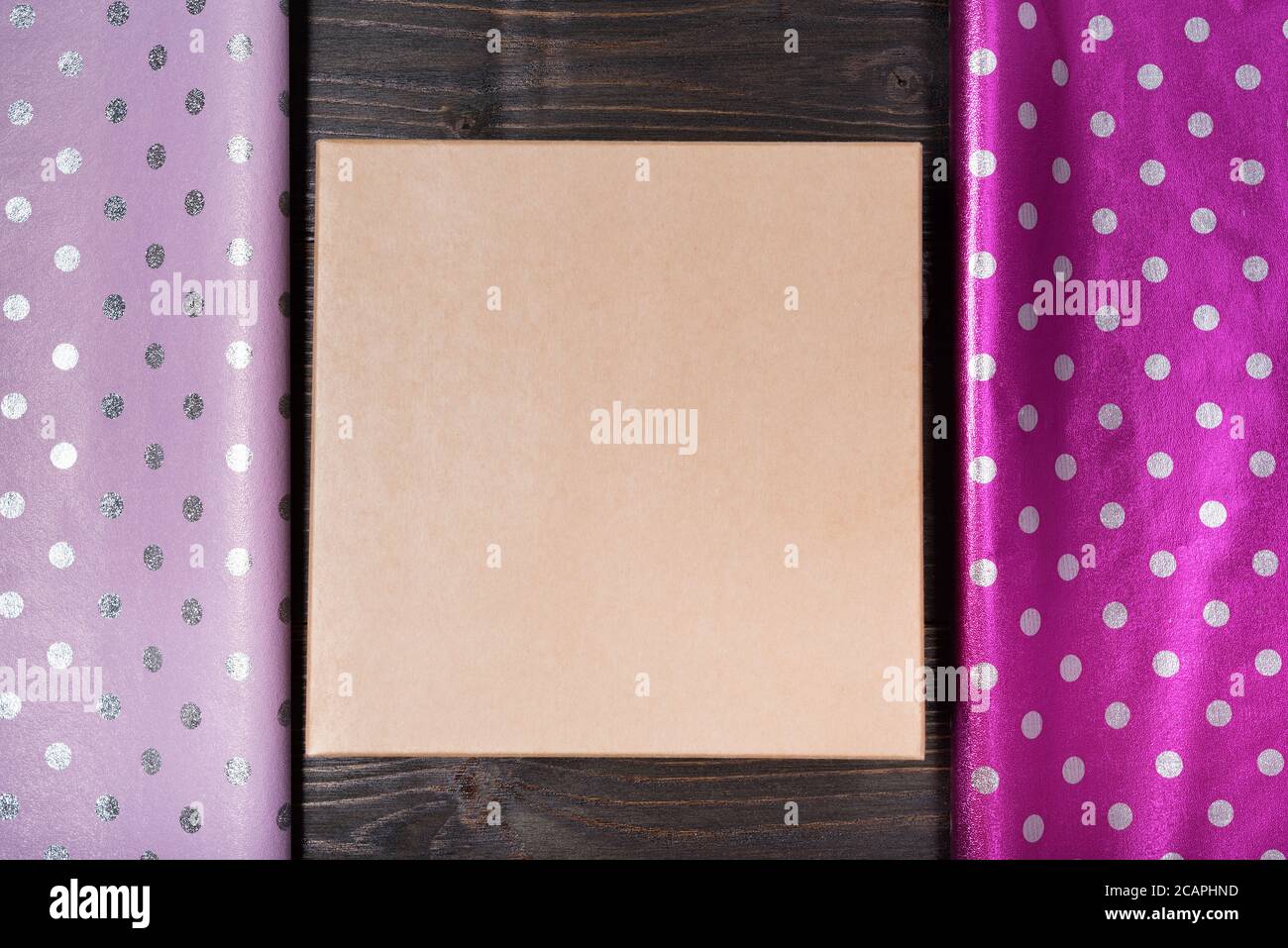 Cardboard box. Lilac and violet shiny polka dot wrapping paper. Foil ...